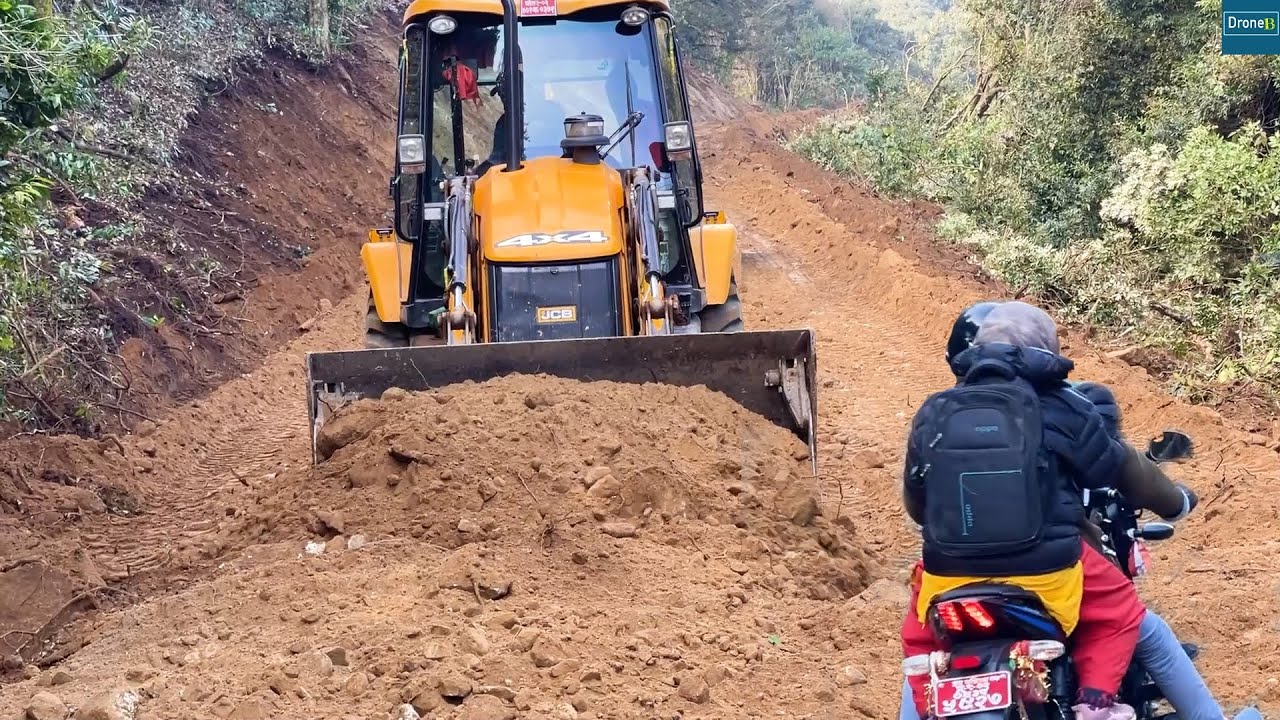 Resurfacing Mountain Road after Excavator with JCB Backhoe - YouTube