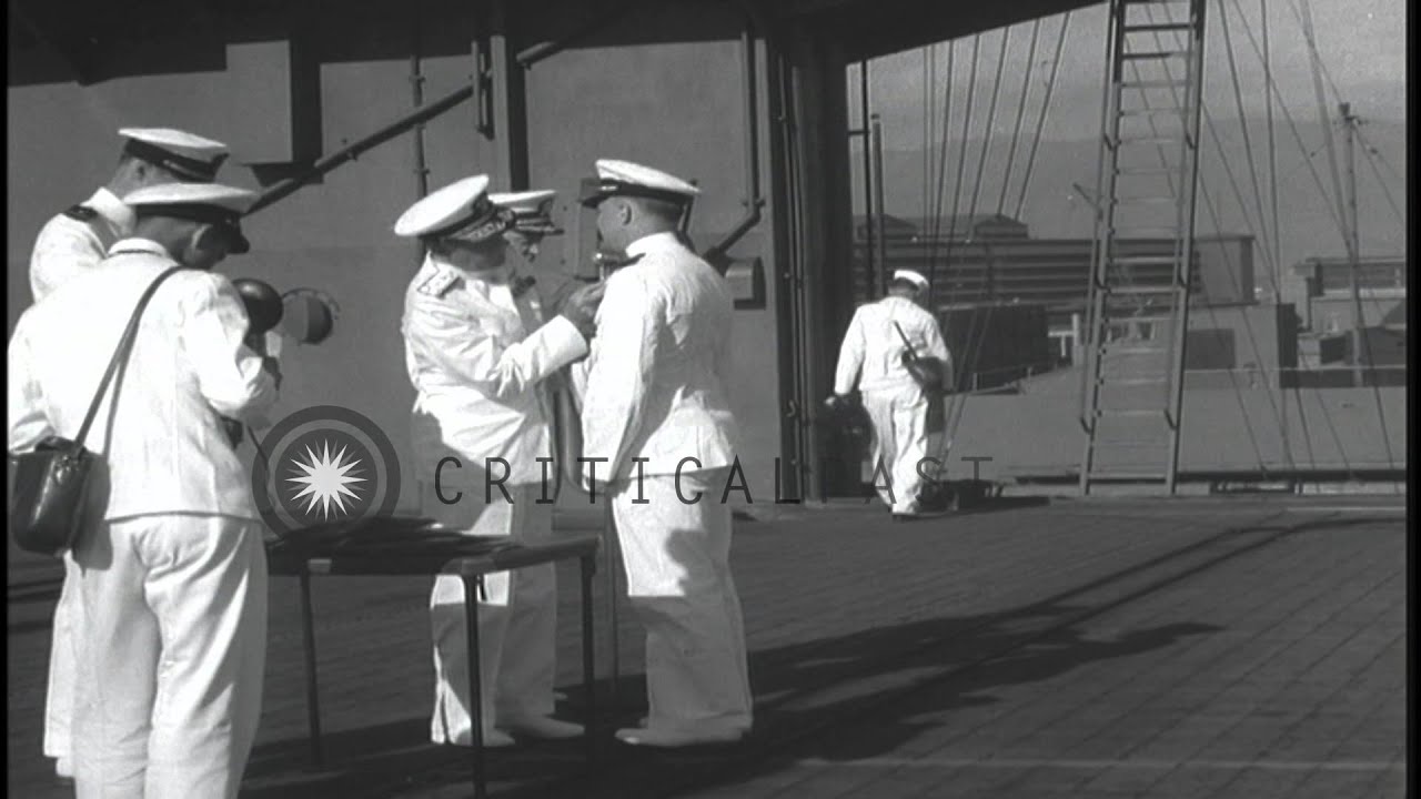 Sailors and officers being awarded aboard a ship at Pearl Harbor in ...