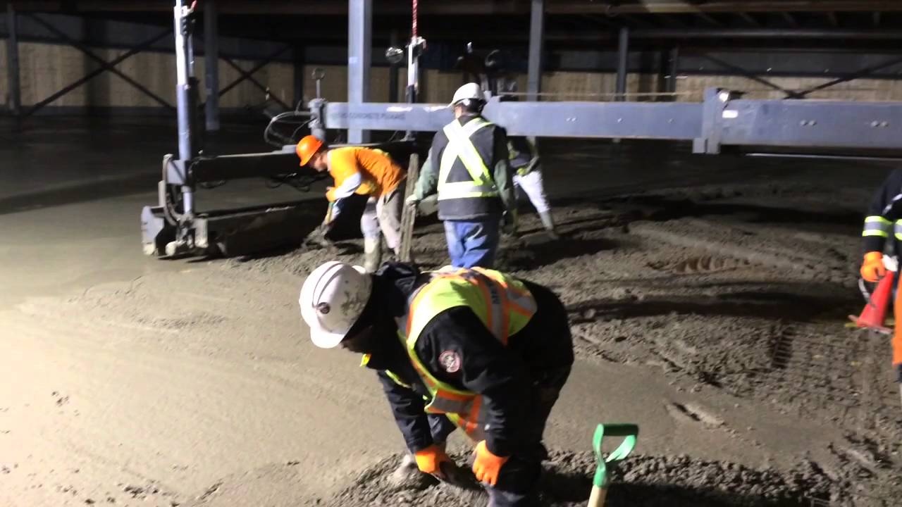 Pouring concrete via laser screed Metro Concrete Floors - YouTube