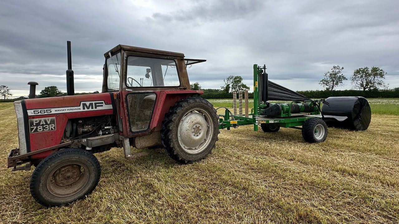 Massey 565 with a mc hale bale wrapper (full throttle) - YouTube