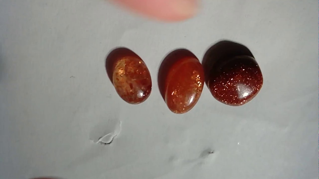Natural sunstone vs goldstone - YouTube