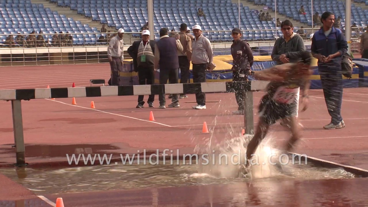 Steeple Chase competition at India's police games - YouTube