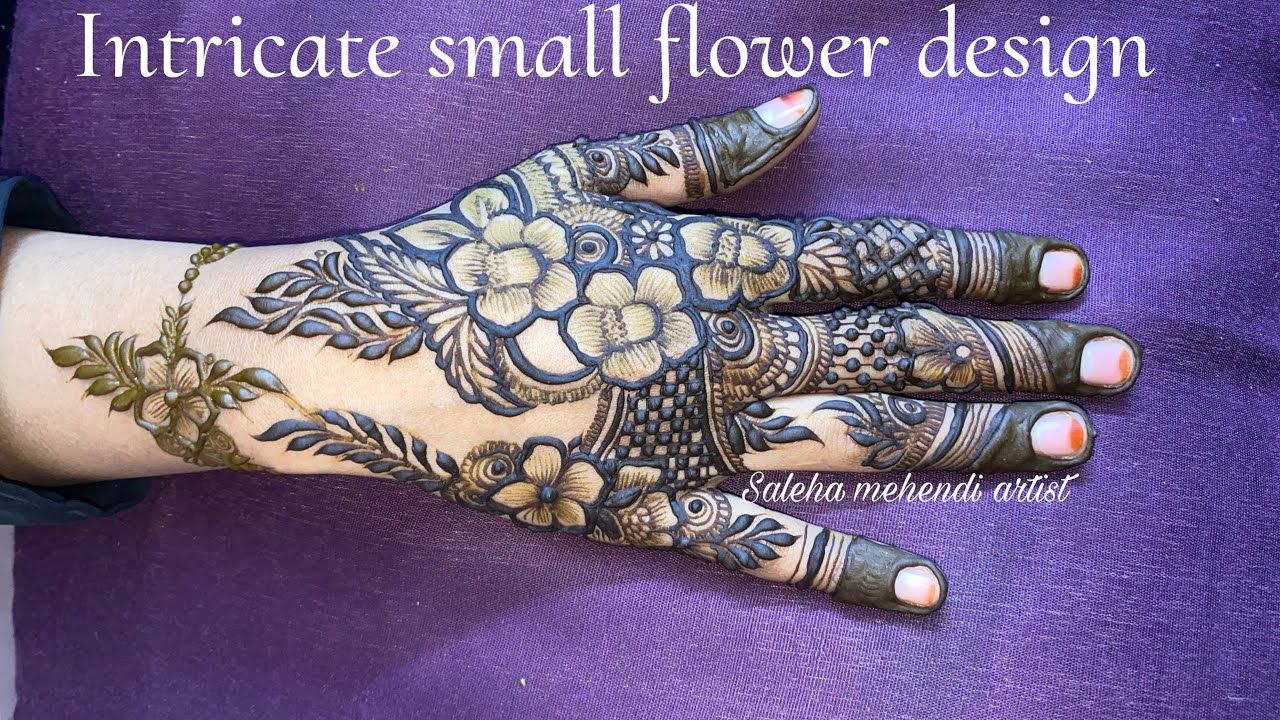 Intricate flowers design for thin hand using small detailing elements ...