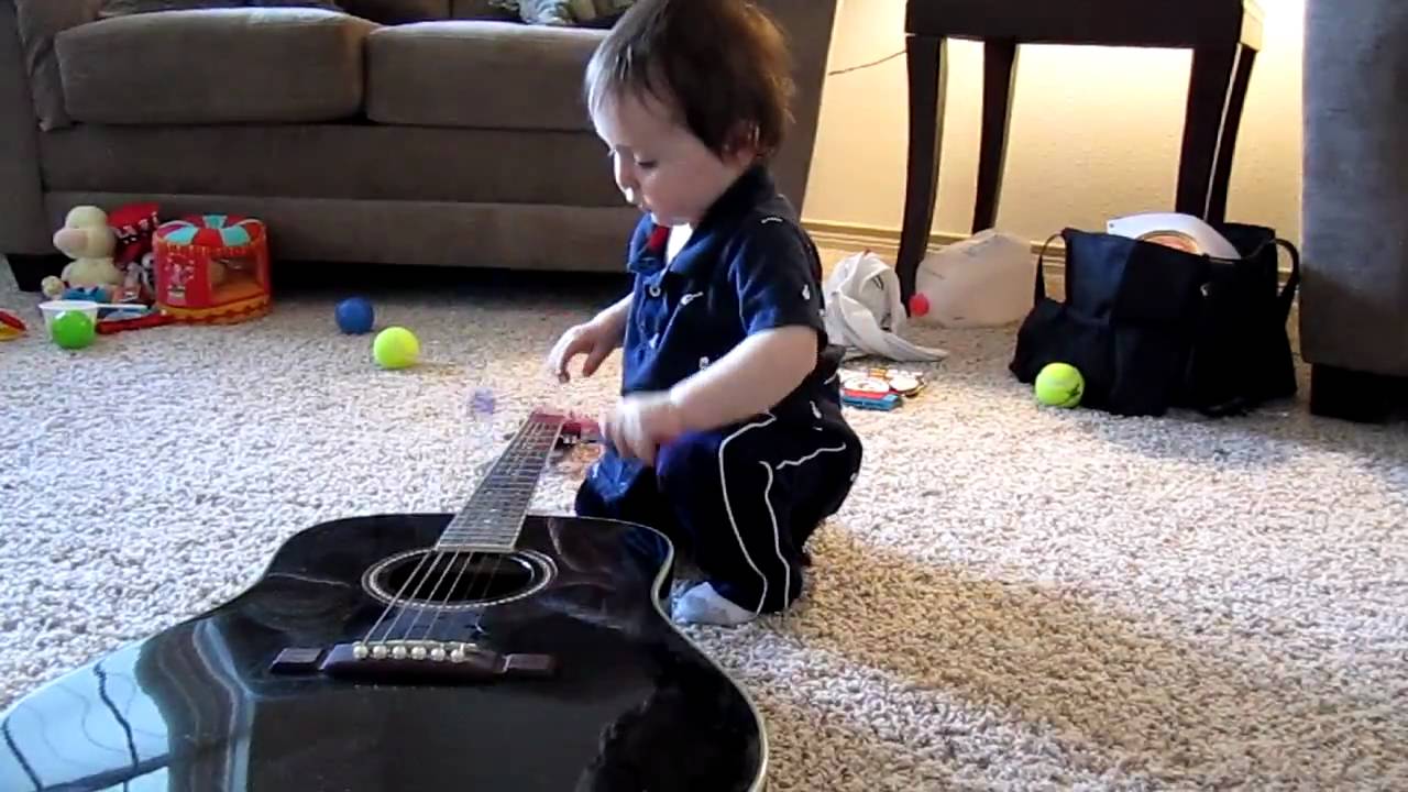 baby plays guitar with toothbrush - YouTube