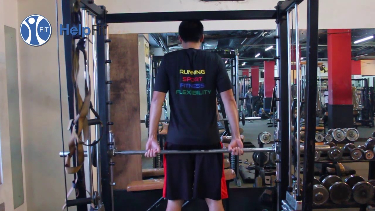 SMITH MACHINE BARBELL SHRUG BEHINE THE BACK - YouTube