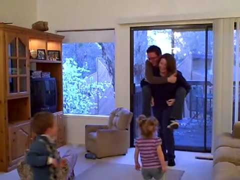 Daddy gets a piggy back ride from Mommy