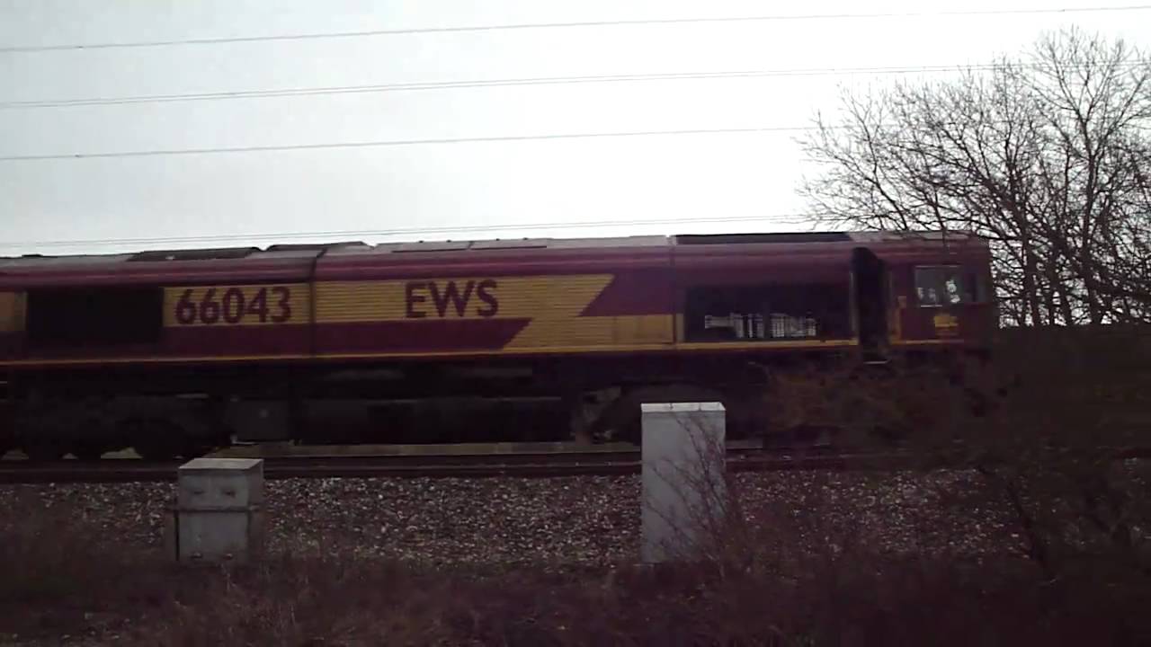 EWS Class 66 No. 66043 from Radley station with a mixed freight train ...