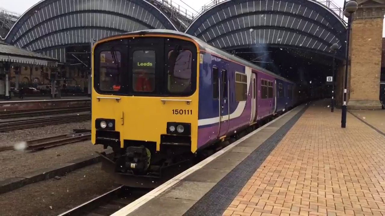 Northern Rail 150111 leads 150218 departing York with a York to Leeds ...