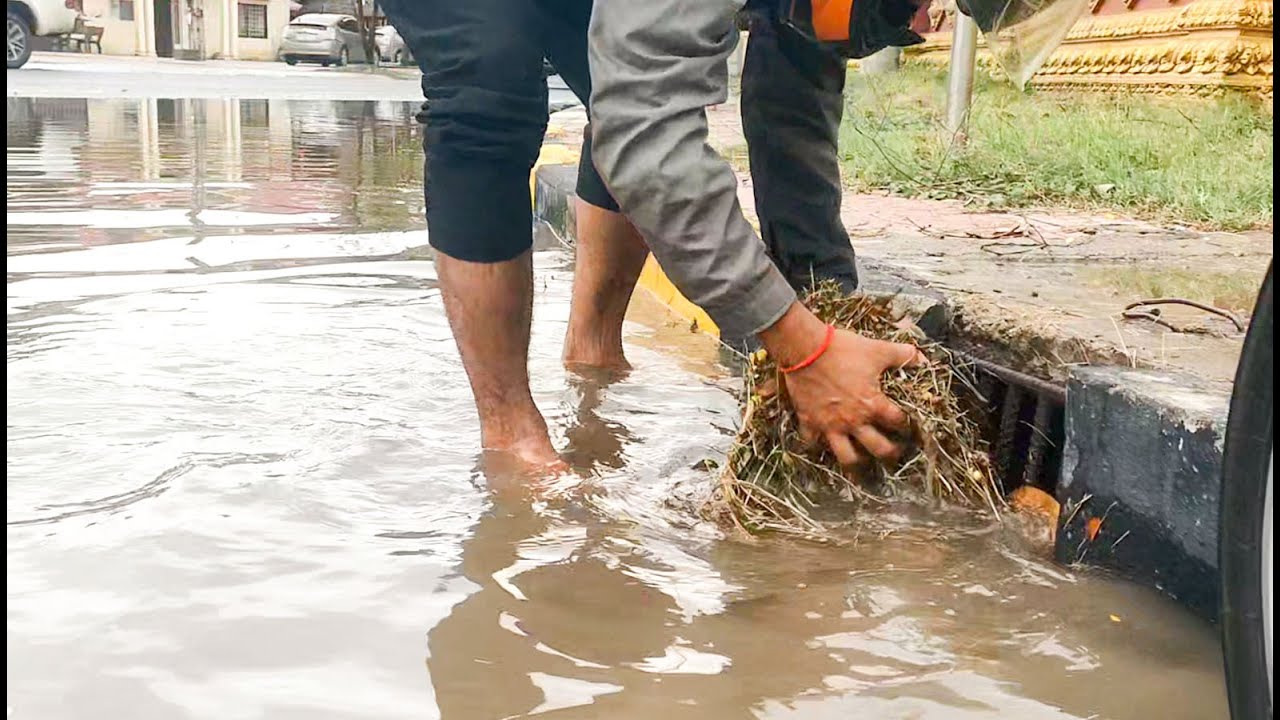 Remove Trash Clogged Culvert Drain On Street Road After Heavy Rain ...