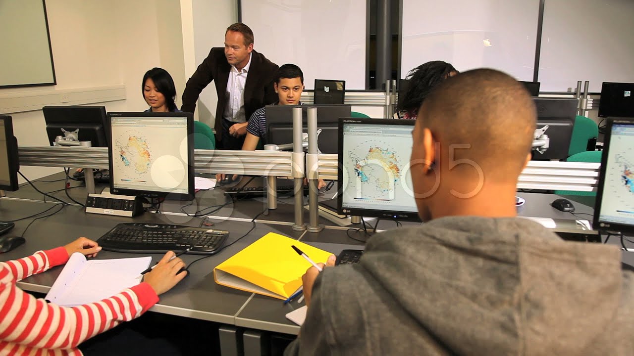 Teacher Guiding Student In Computer Class. Stock Footage - YouTube