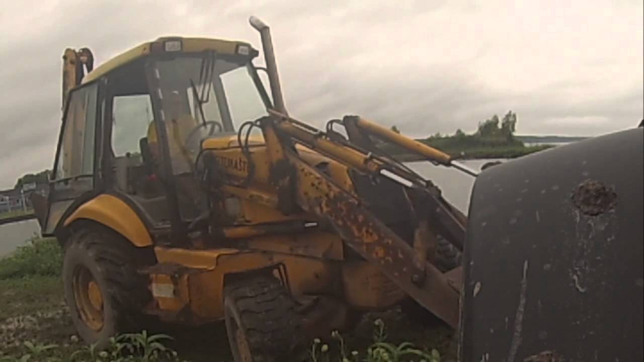 Jeep Wrangler stuck and getting pulled out by backhoe - YouTube
