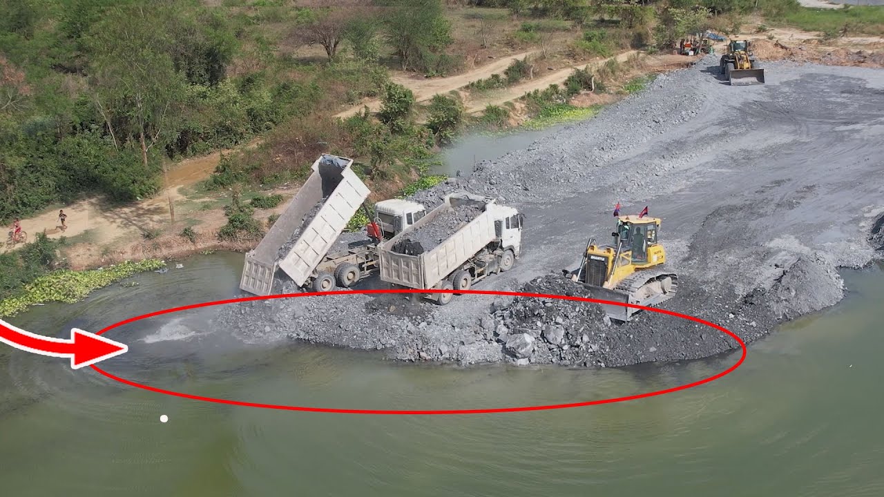 Wonderful Powerful Strong Wheel Loader Push Stones into Water Bulldozer ...