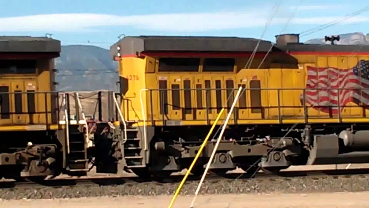Union pacific #6276 and #6397 loaded flat cars in security widefield ...