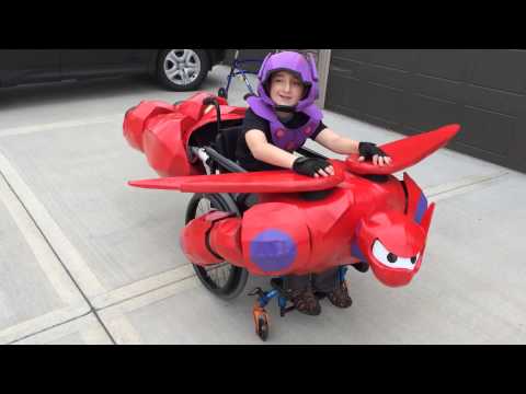Hiro RIDING Baymax in a wheelchair costume