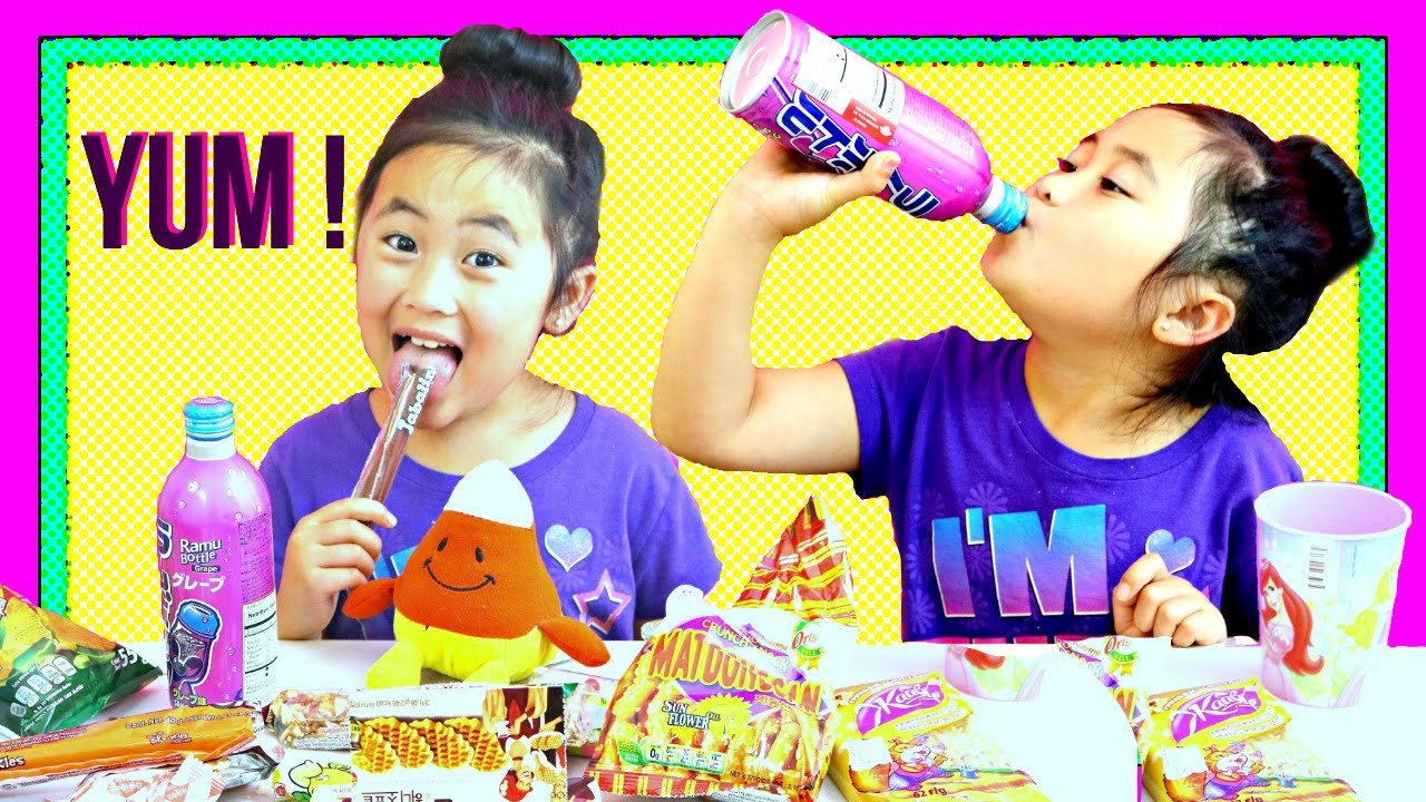 Asian American kid trying out snack, candies from around the world ...