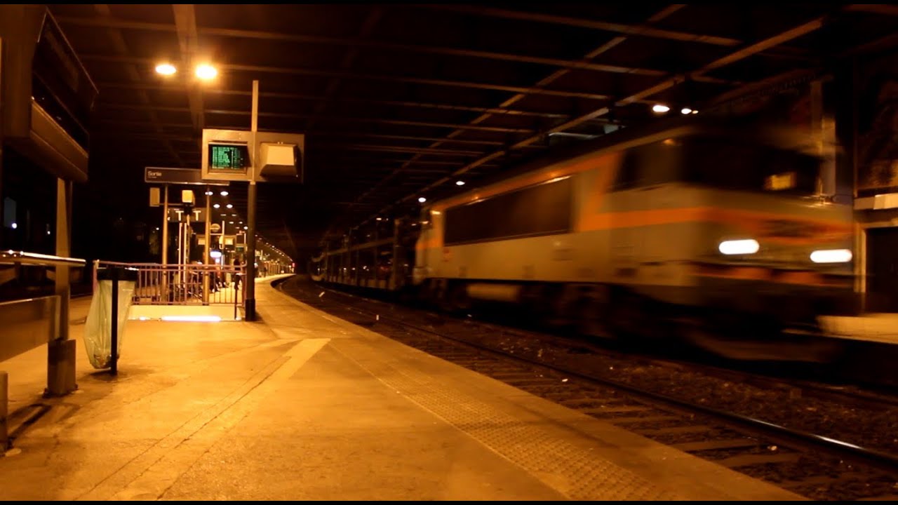 Freight train crossing Cannes station - YouTube