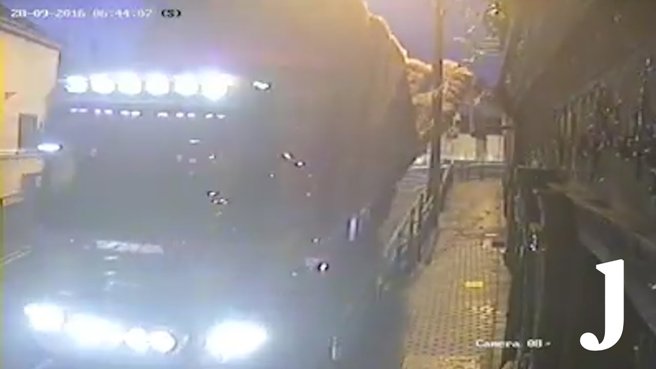 CCTV footage of hay bales falling off truck in Ardee causing damage ...