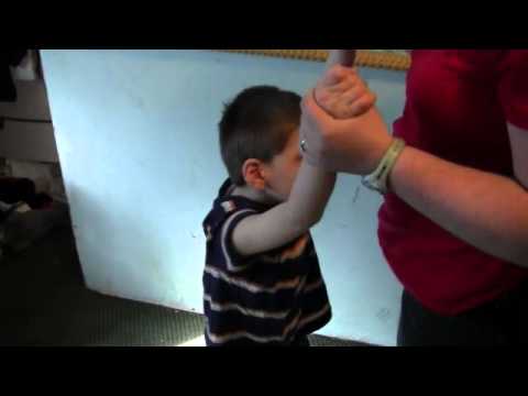 Thomas standing up with help 4-19-12