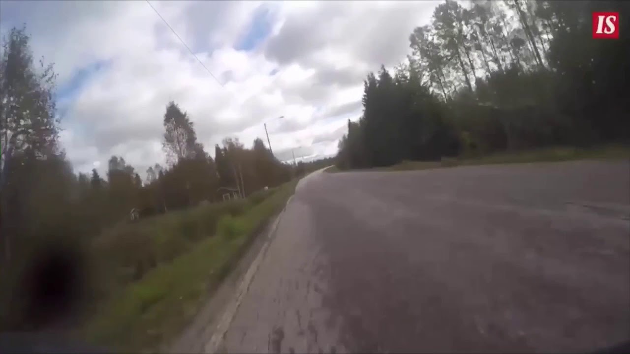 Atv driver pushes Finnish motorcycle police to road railing. Officer ...