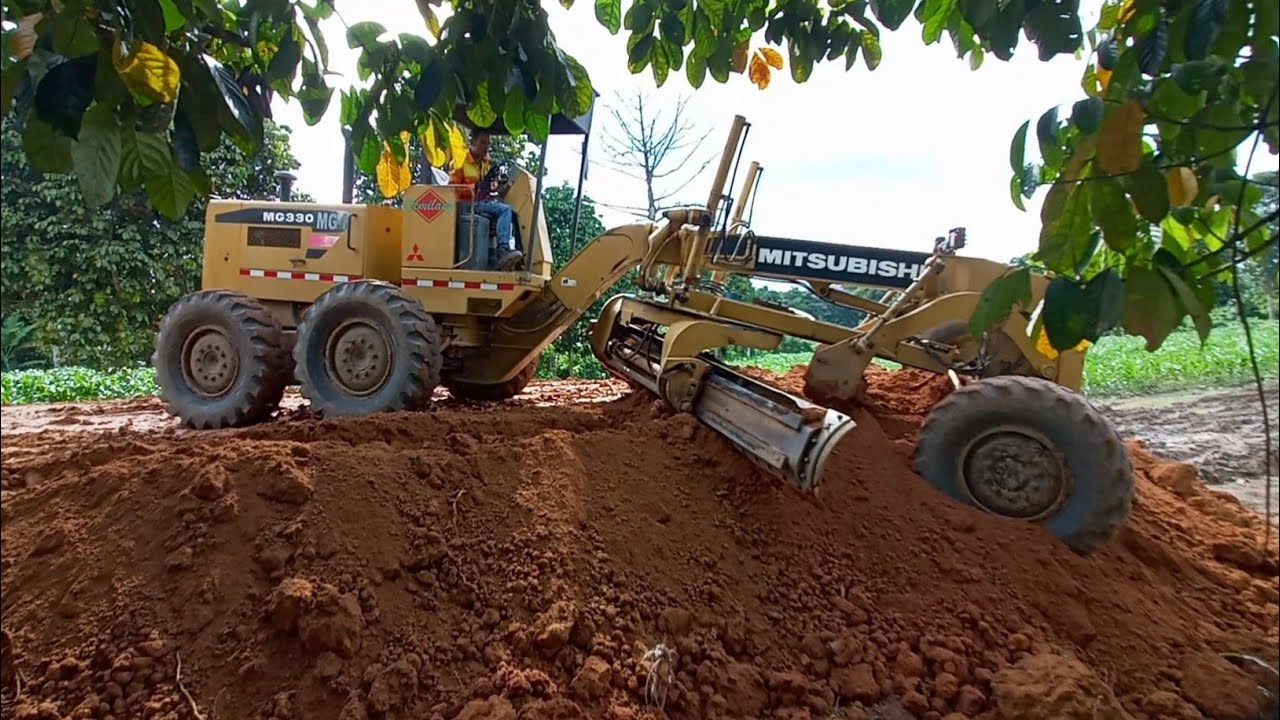 Motor Grader Spreading Soil For New Road Backfill - YouTube