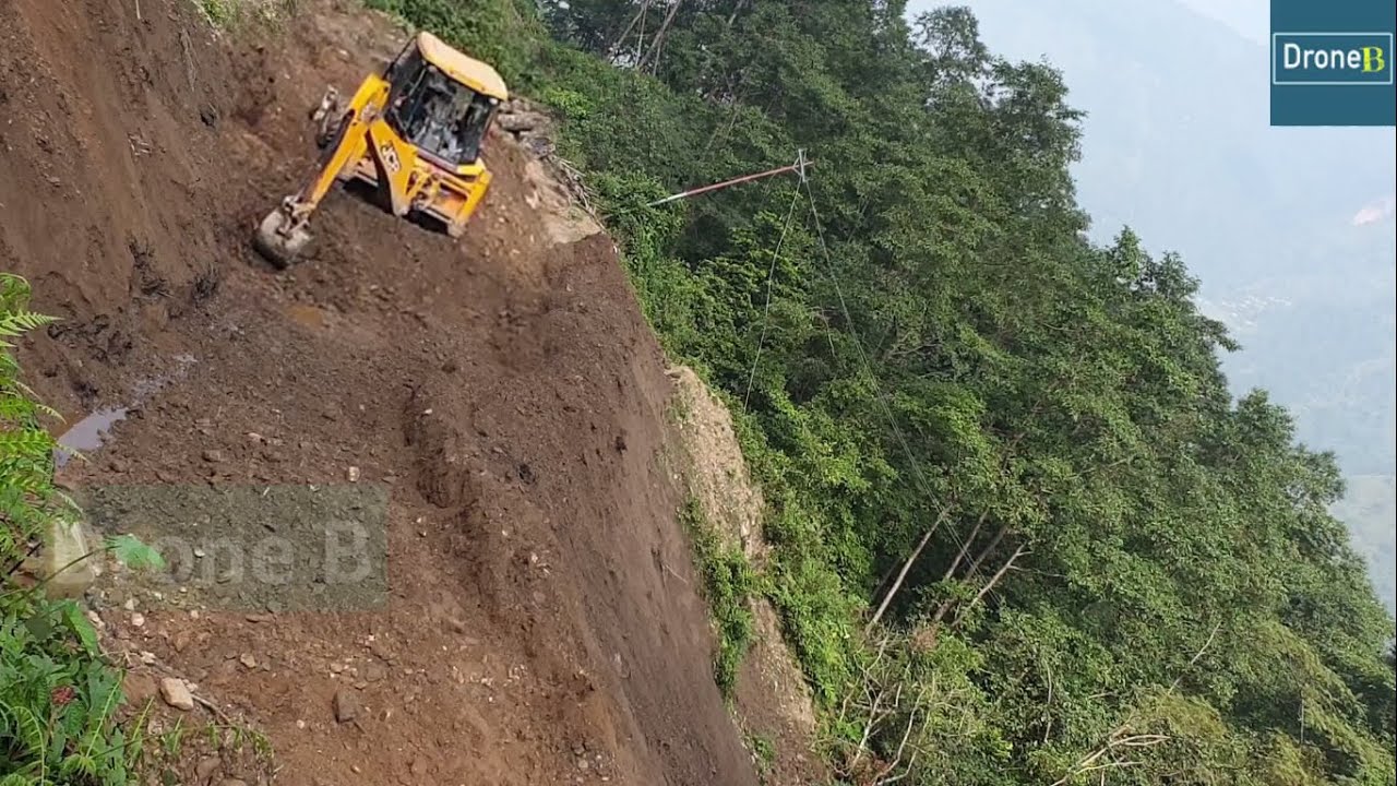 Massive Landslide-Backhoe Loader-Cutting Trench across Hilly Road - YouTube