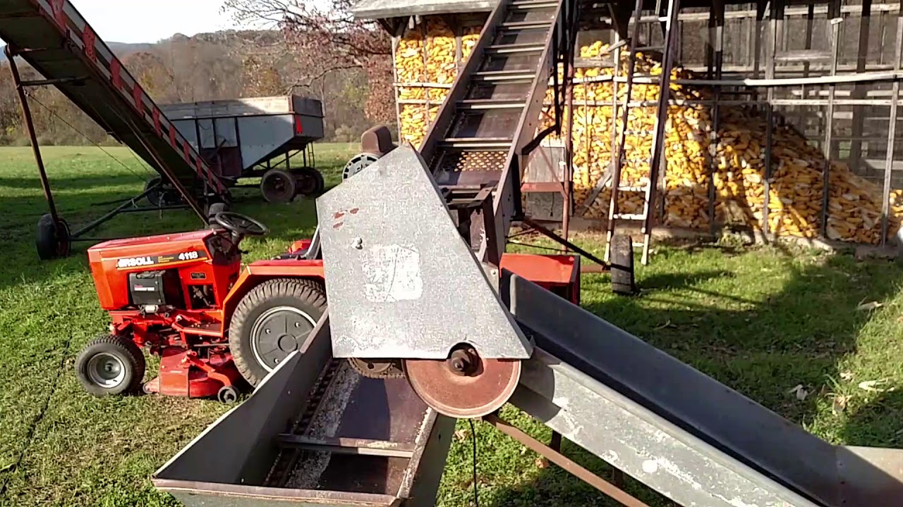 Filling the corn crib, lawn tractor and a grain cart. - YouTube
