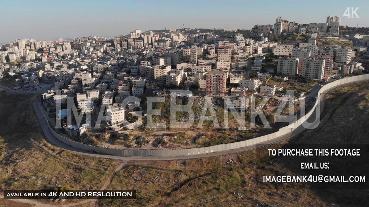 Israel wall fence in Jerusalem aerial view - YouTube