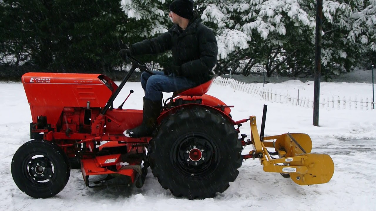 1977 Economy Tractor pushing snow with a Gannon Earthcavator - YouTube