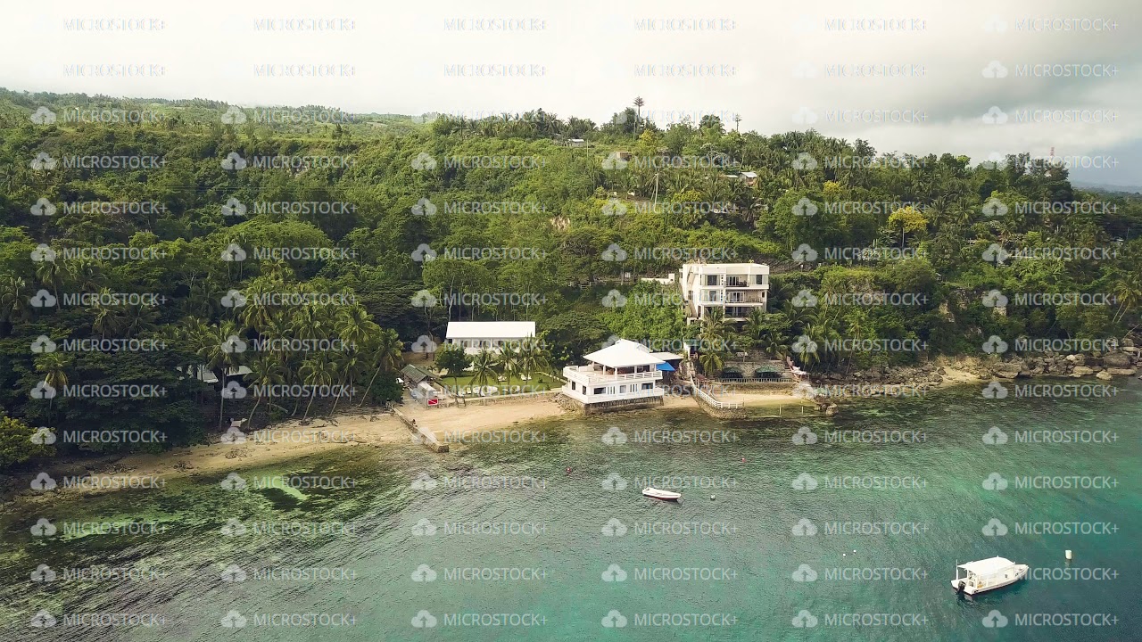 Aerial view buildings on tropical island on sea beach. Resort hotel on ...
