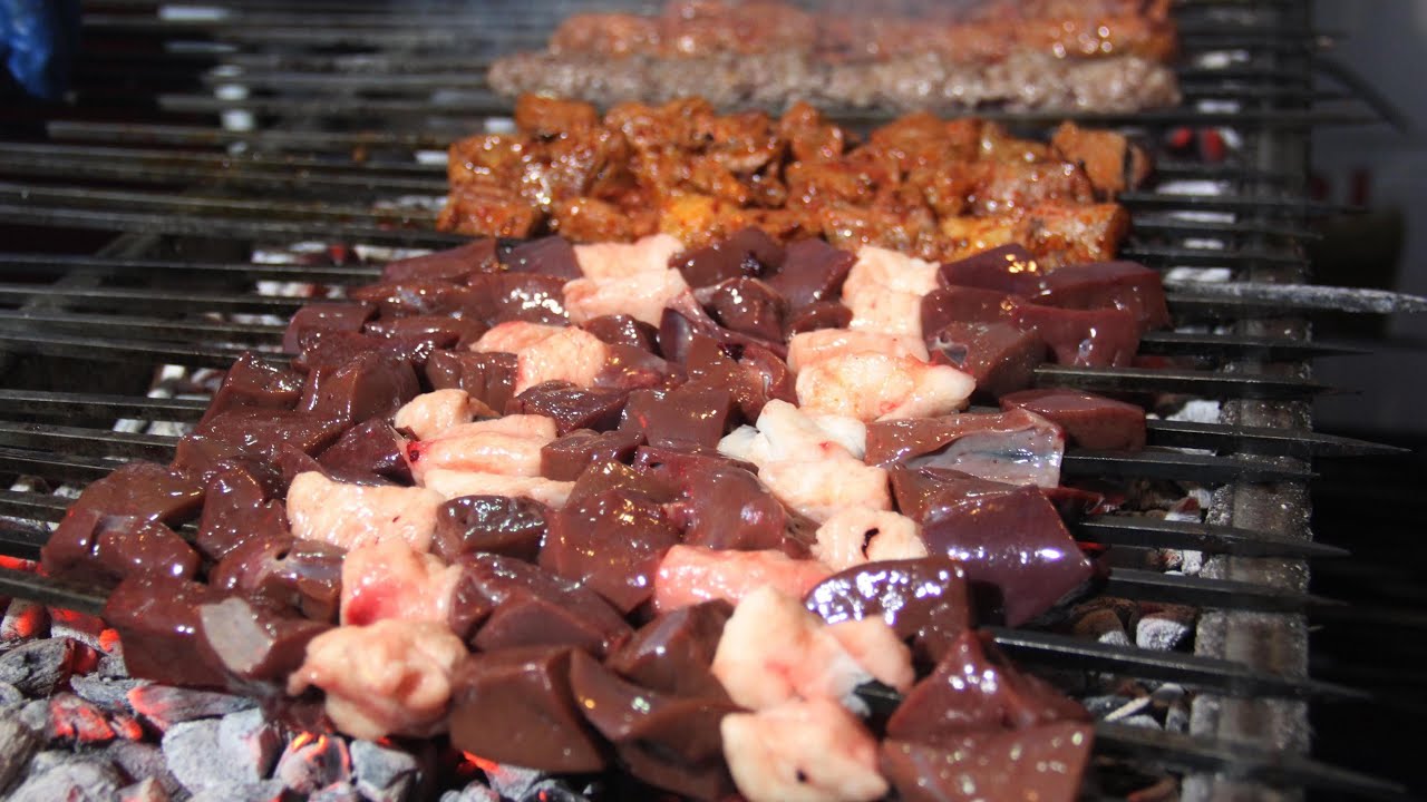 Grilled heart, liver and lamb on a handmade grill in the mountains of ...