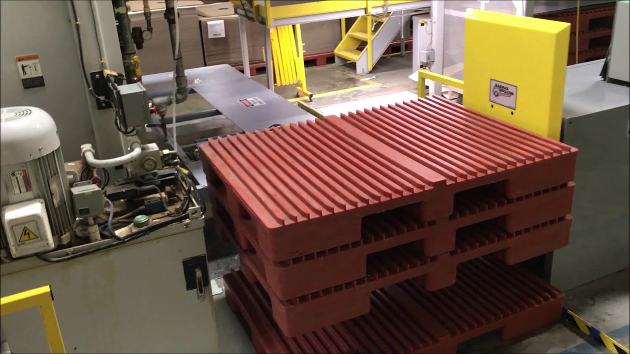 Harmax pallet dispenser with pallet sweep arm - YouTube