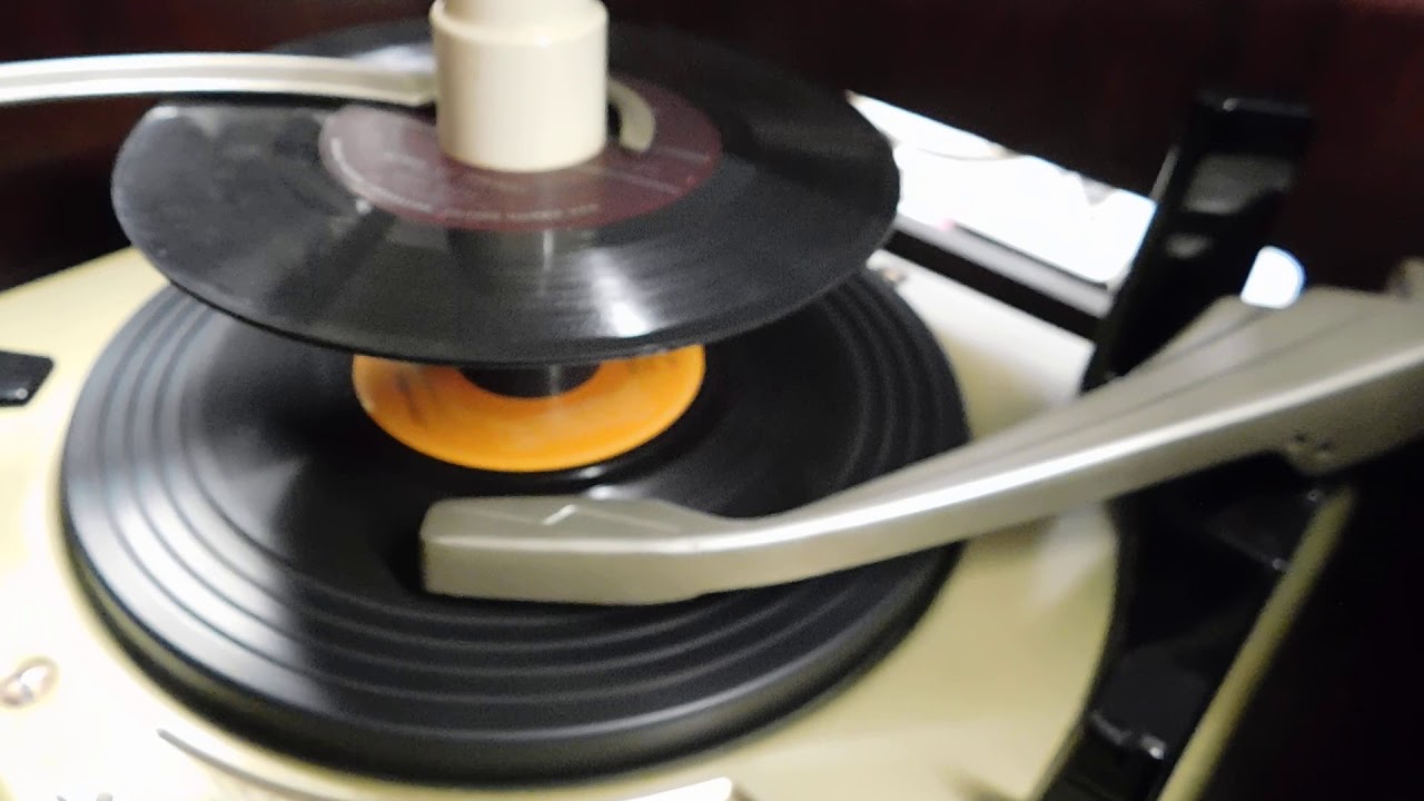 Silvertone 4 speed record player playing a stack of 45's - YouTube
