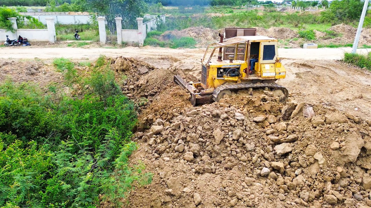 Amazing skill bulldozer operator pushing soil filling land and leveling ...