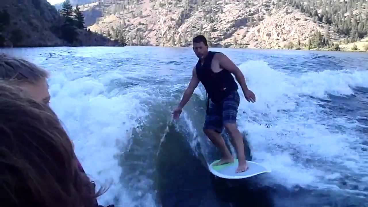 Wake surfing behind a Sanger V215 at Hauser Lake Montana - YouTube