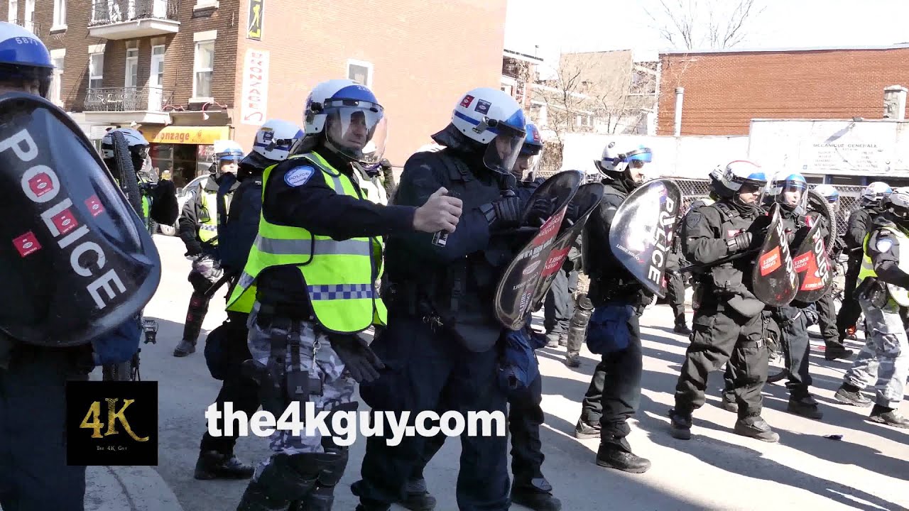 4K UHD - Riot police shooting pepper spray towards crowd of protesters ...