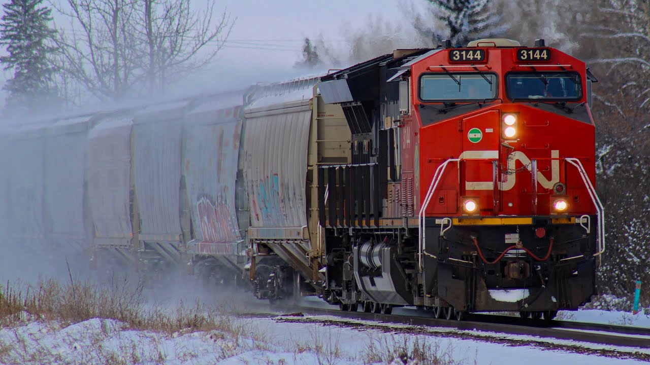 SUPER RARE! CN ET44AC Leader CP grain train Eastbound through Edworthy ...