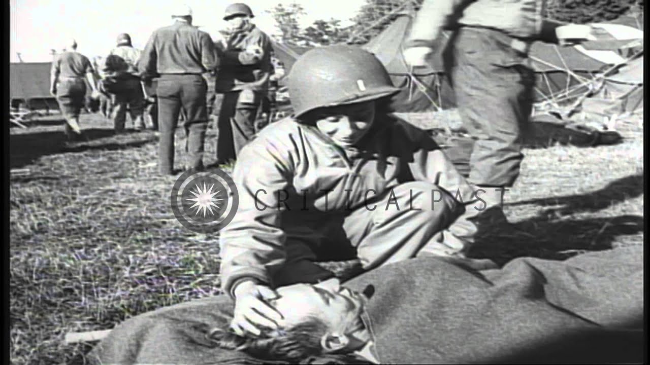 Wounded US soldiers being brought at a field hospital after Allied ...