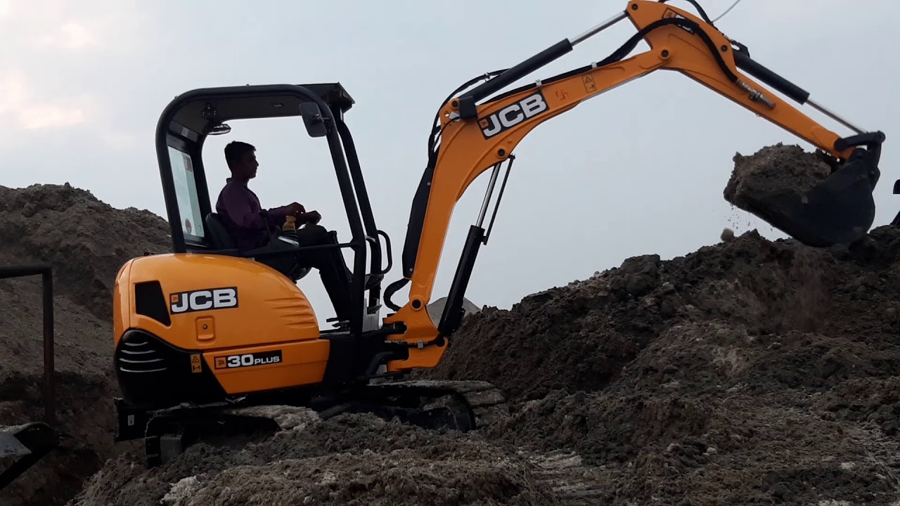 JCB30Plus Mini Excavator - Climbing onto Gypsum Heap and feeding to ...