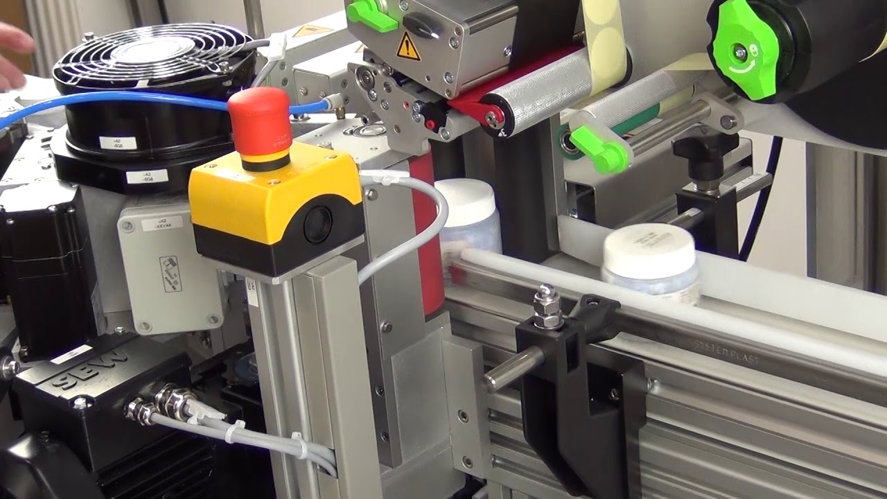 Fully wrapped around cap labelling of plastic bottles | bb-automation ...