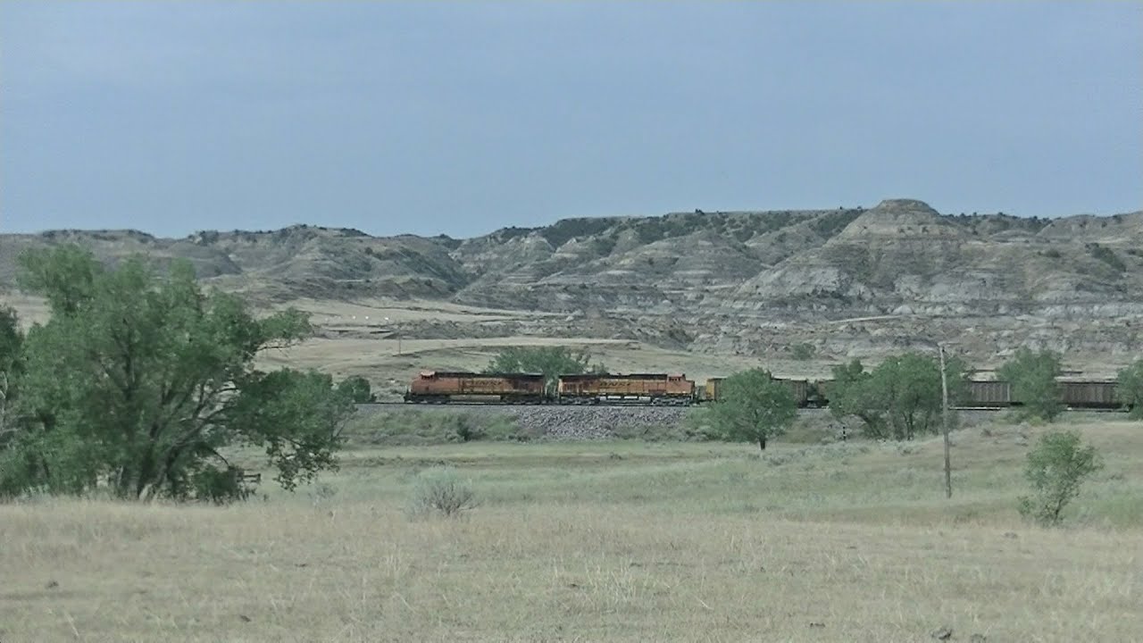 Three BNSF GE's pulling coal along Glendive Creek in the Montana ...