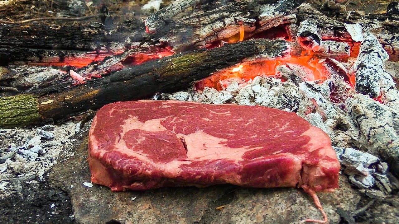 Cooking Meat Survival Style on a Rock - YouTube