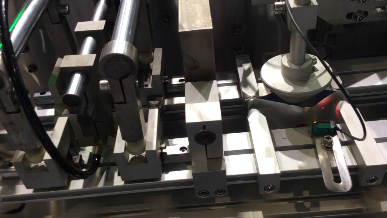 facial mask filling machine and sealing machine - YouTube