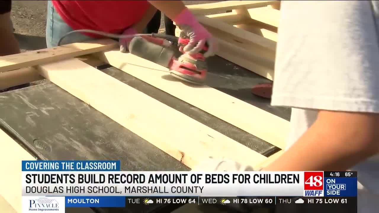 Douglas High students build 100+ beds for children in need - YouTube