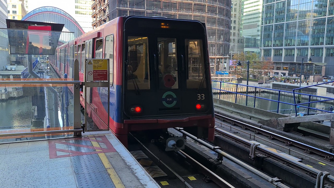 DLR B2K Stock 08 Departing Heron Quays - YouTube