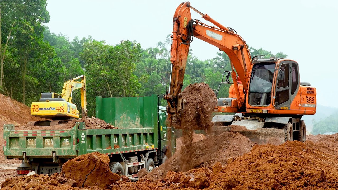 Much Wheel Loader Loading Soil On Trucks on Construction Site - JCB ...