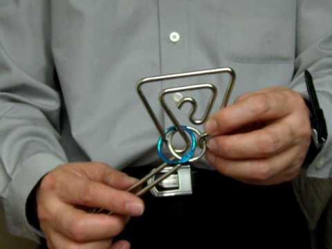 Metal ring puzzle with rings intra-locked within a principle frame Part ...