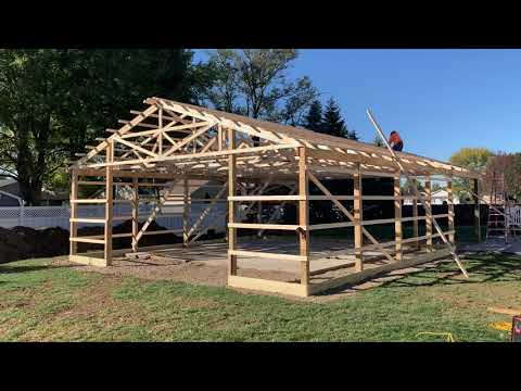 24x32 pole barn under construction in town. - YouTube