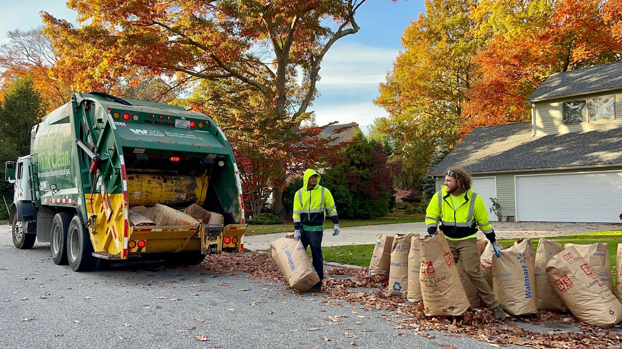 WM Garbage Truck Packing Leaf Bag Piles - YouTube