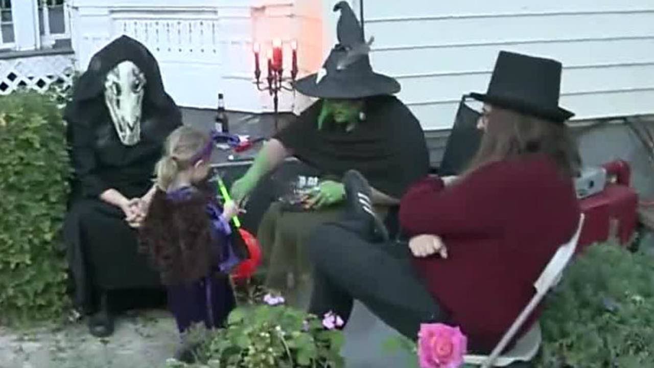 Children enjoy trick-or-treating on Halloween night - YouTube