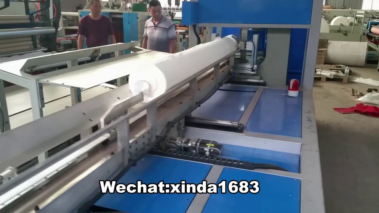 Automatic maxi roll rewinding machine with the automatic band saw ...